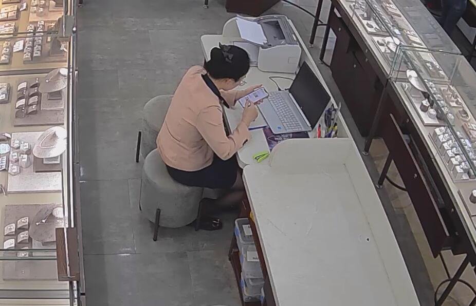 The jewelry store hostess in black nylon dipping shoeplay under the table 6