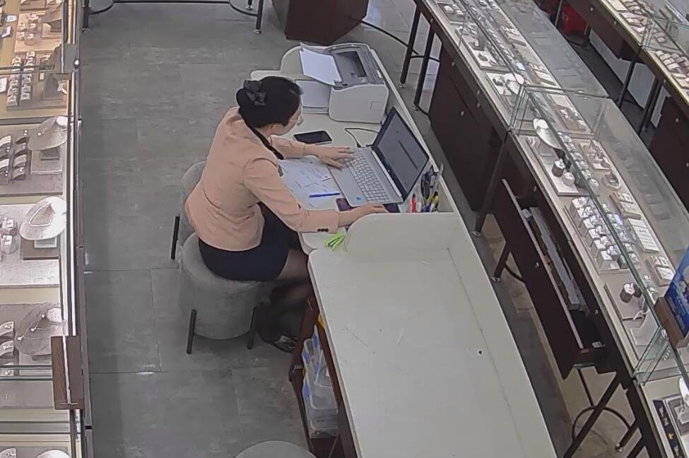 The jewelry store hostess in black nylon dipping shoeplay under the table 6